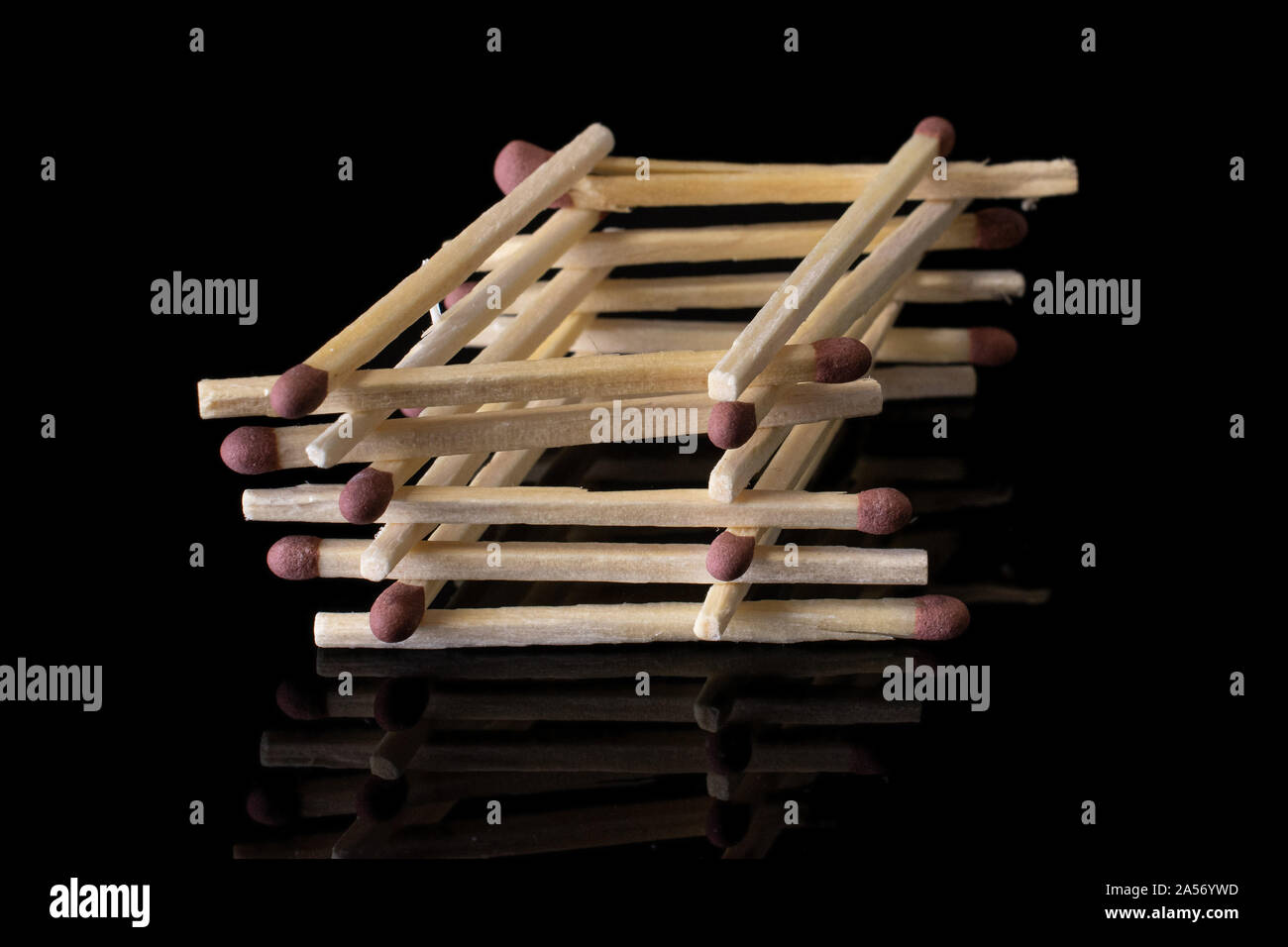 Lot of whole brown safety match tower isolated on black glass Stock ...