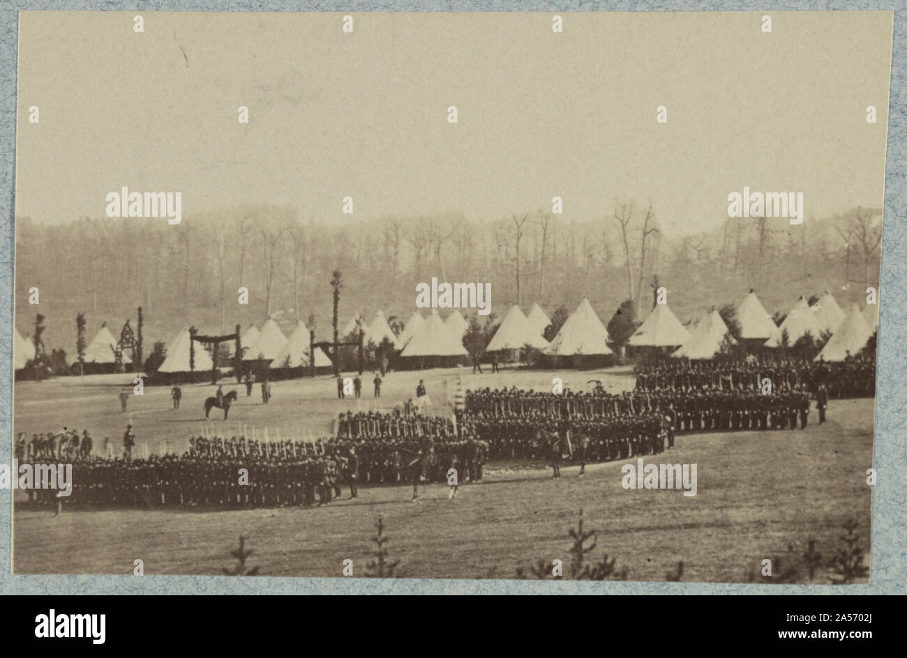 View of troops in formation with camp in background Stock Photo - Alamy