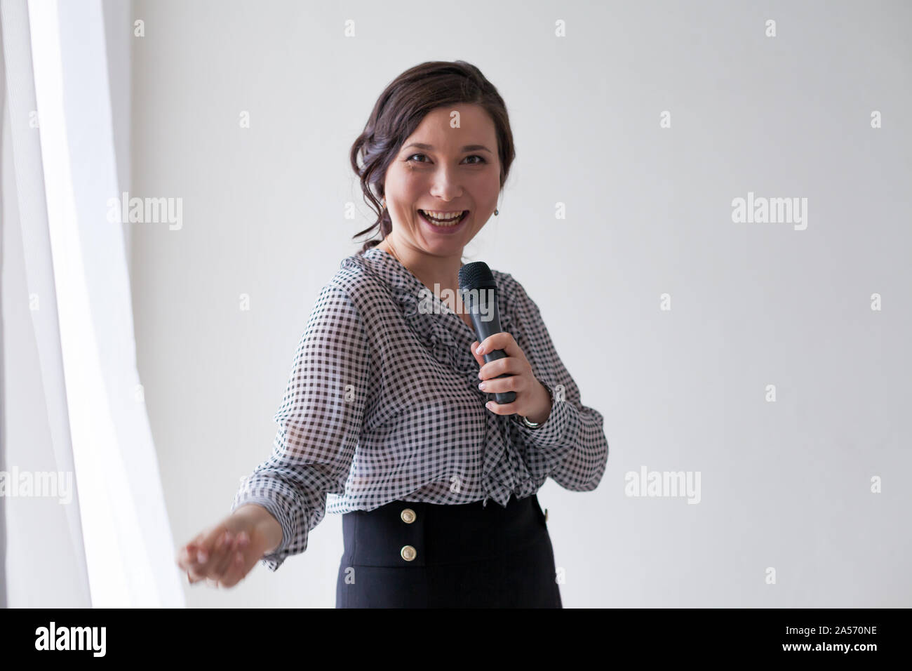 portrait of a beautiful Asian woman with a microphone talking Stock ...