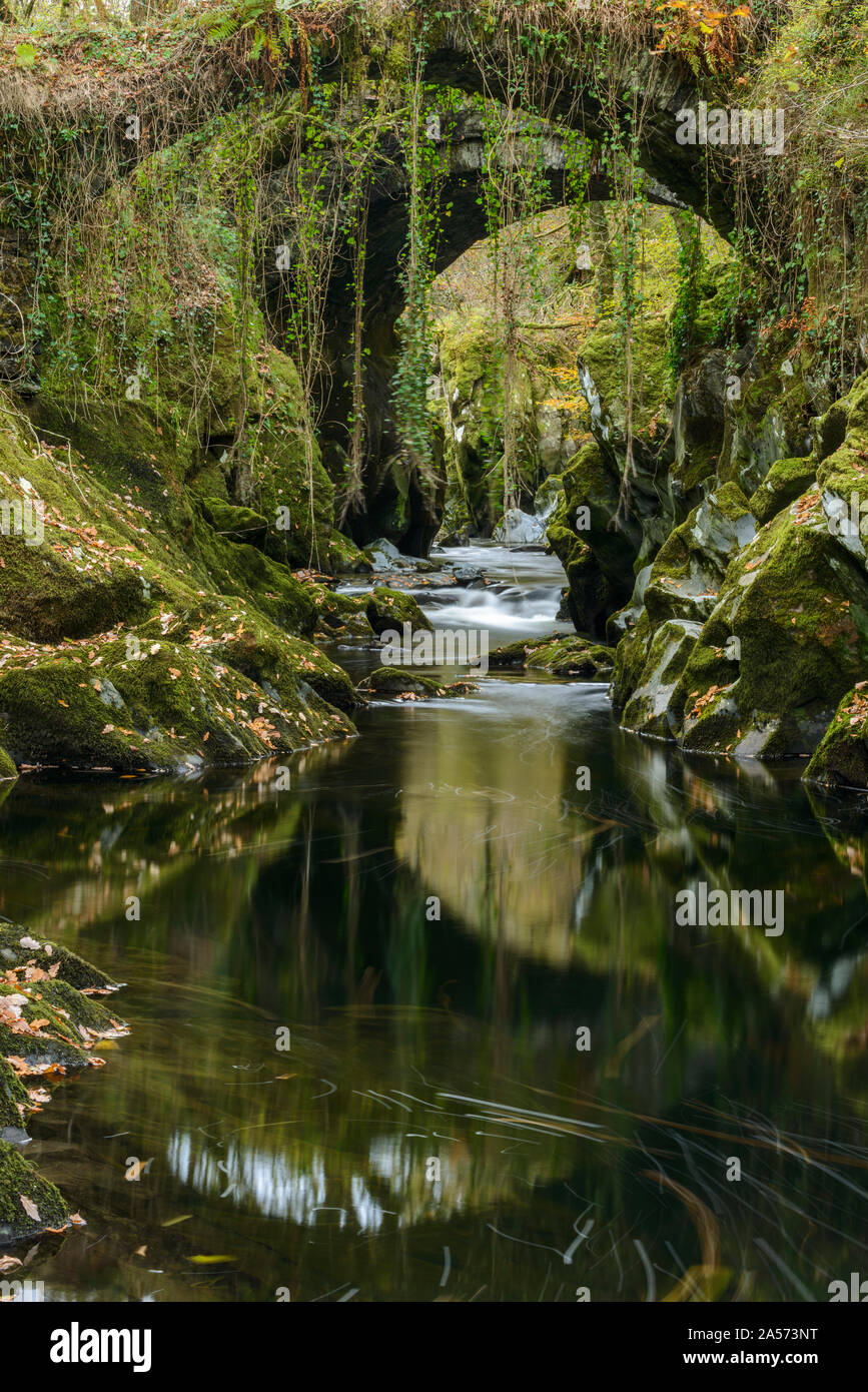 An ancient packhorse bridge crossing the River Machno near Penmachno ...