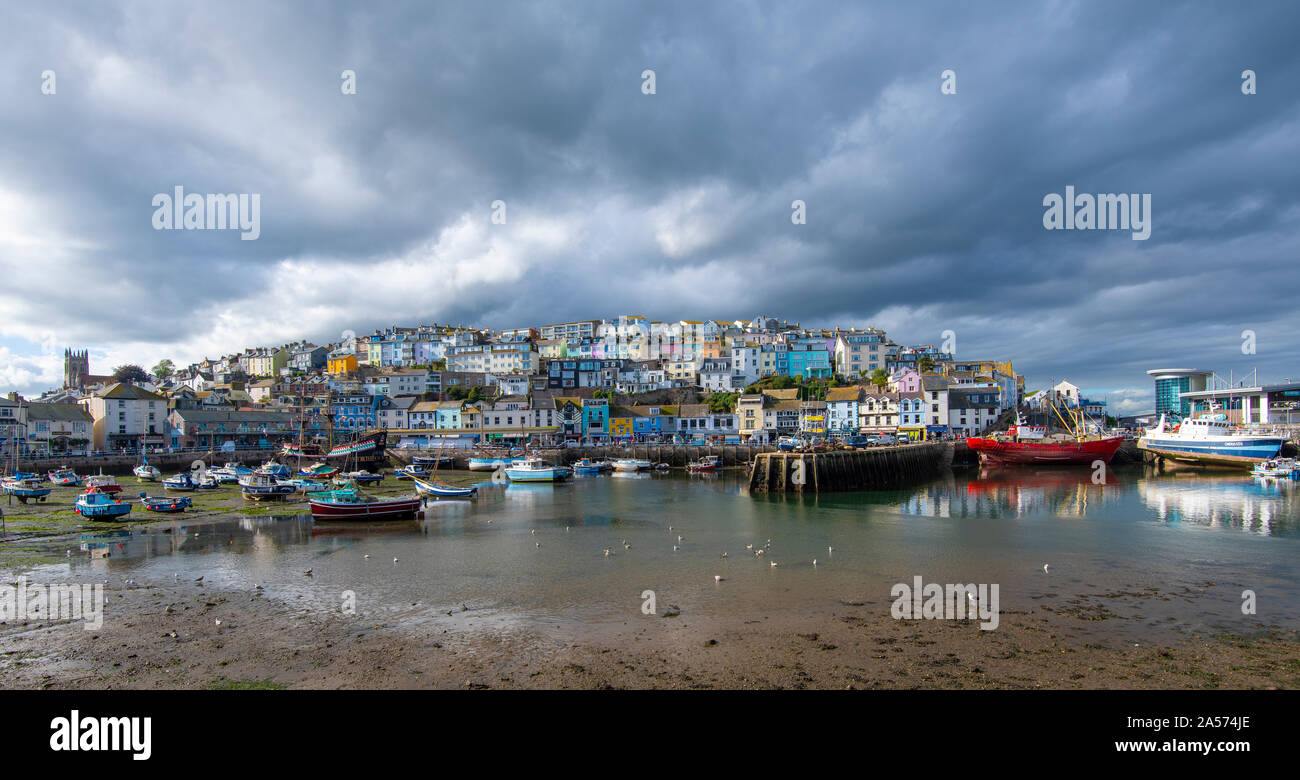 The port of Brixham, Devon at low tide in the month of October Stock ...