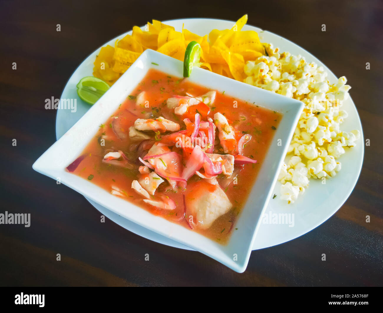 Ecuador food: fish ceviche, raw fish. with popcorn and plaintain Stock ...