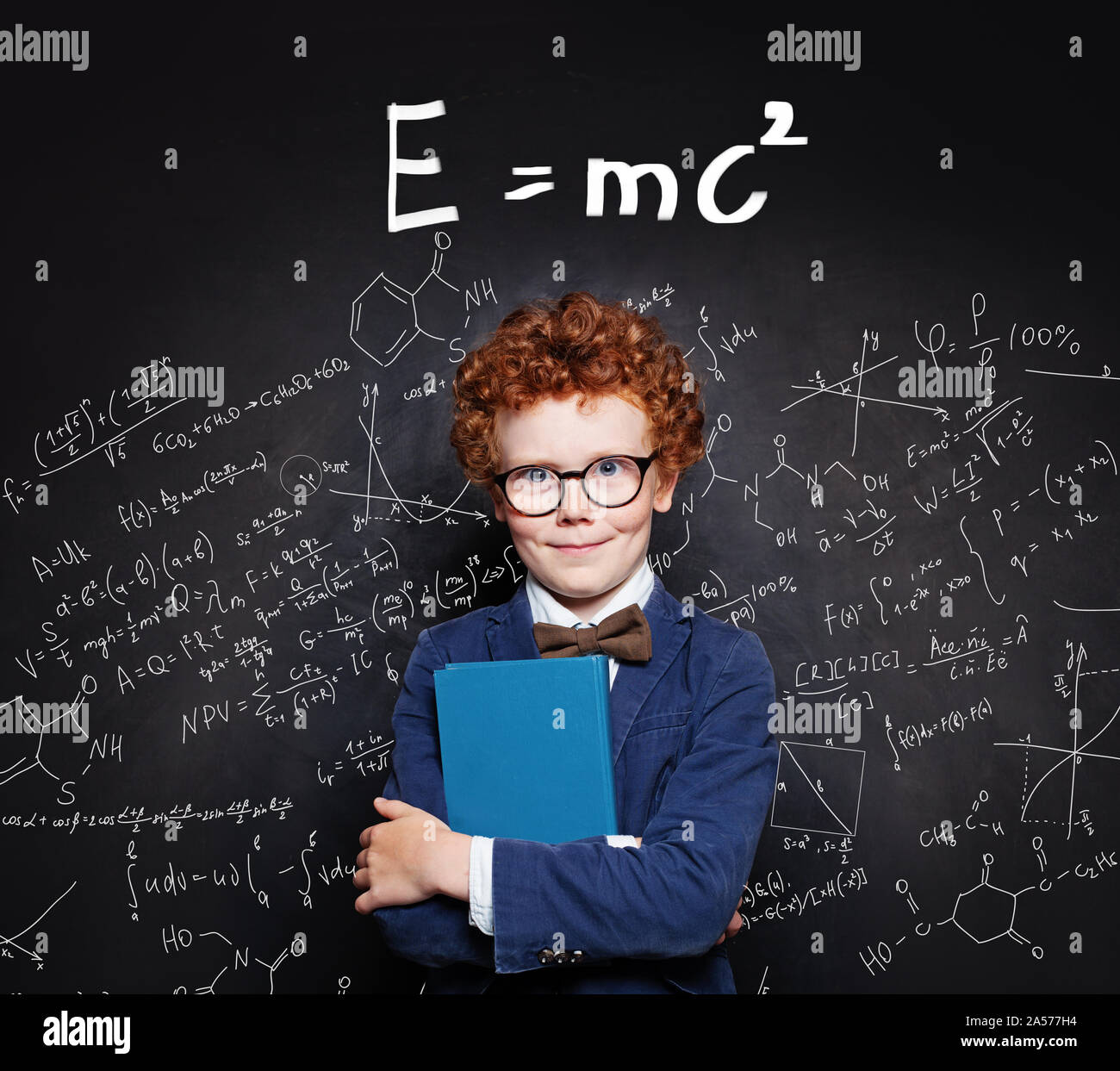 Pretty child boy student in suit and glasses learning science Stock ...
