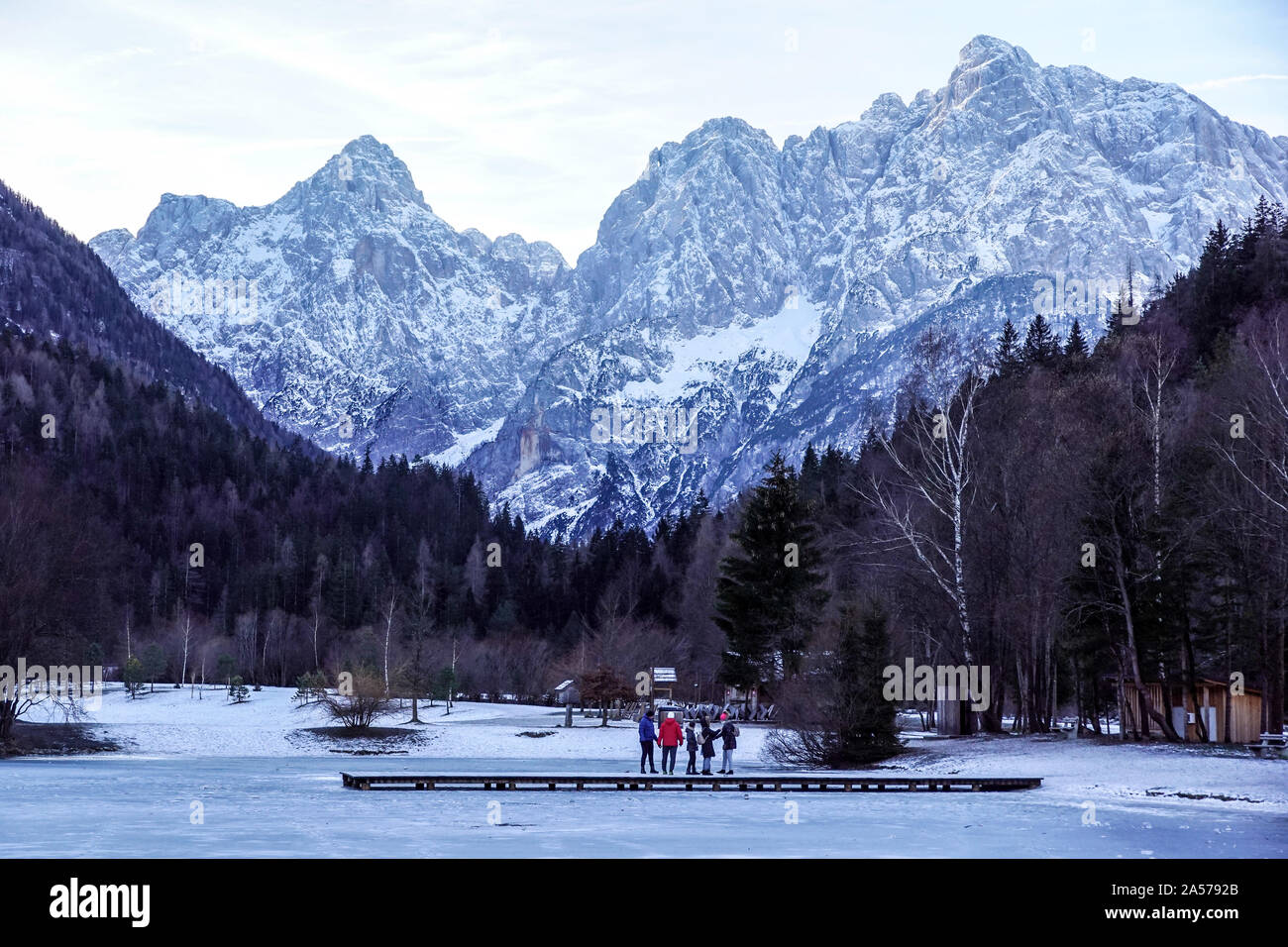 Tourist at Misurina lake sunset blue winter Dolomites Val di Funes ...