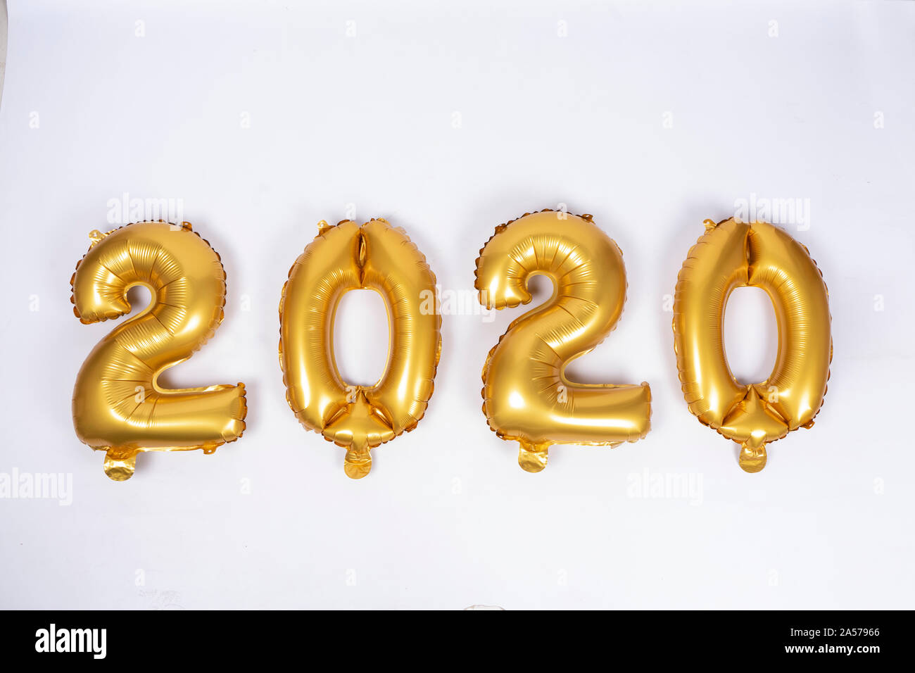 Foil balloons in the form of numbers 2020. New year celebration. Gold ...