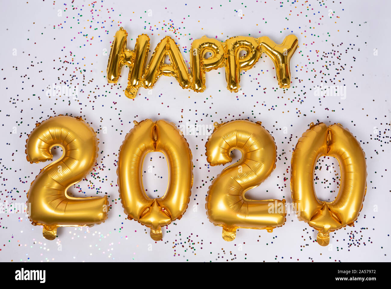 Happy 2020 lettering of frustrated gold balloons isolated with colorful ...
