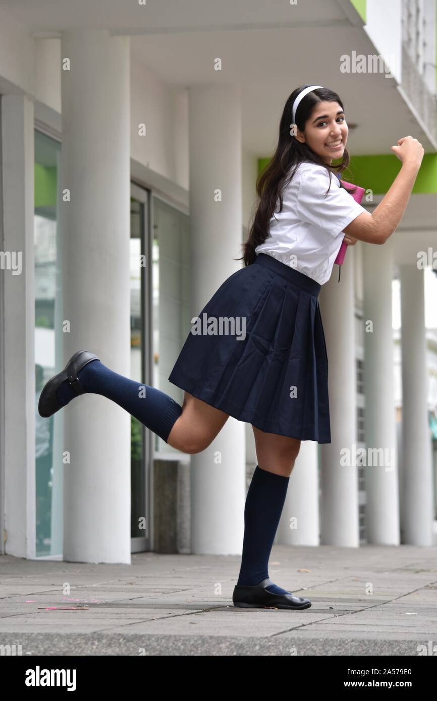 Cute Female Student Running Wearing Skirt Stock Photo - Alamy