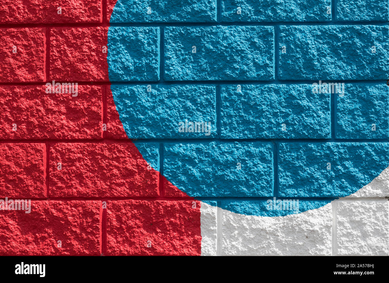 Close up on Colourfully painted red, white and blue brick wall Stock ...