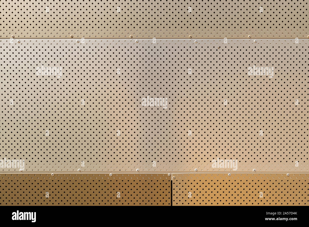 Metal surfaces of different light color shades with round openings ...