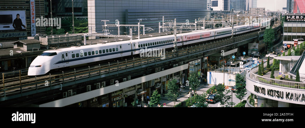 300 series Shinkansen train arriving at a railroad station, Tokyo ...
