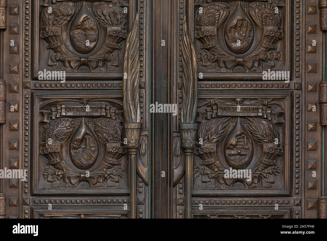 Minsk, Belarus - June 2019. Wooden door with engraving of memorials of ...