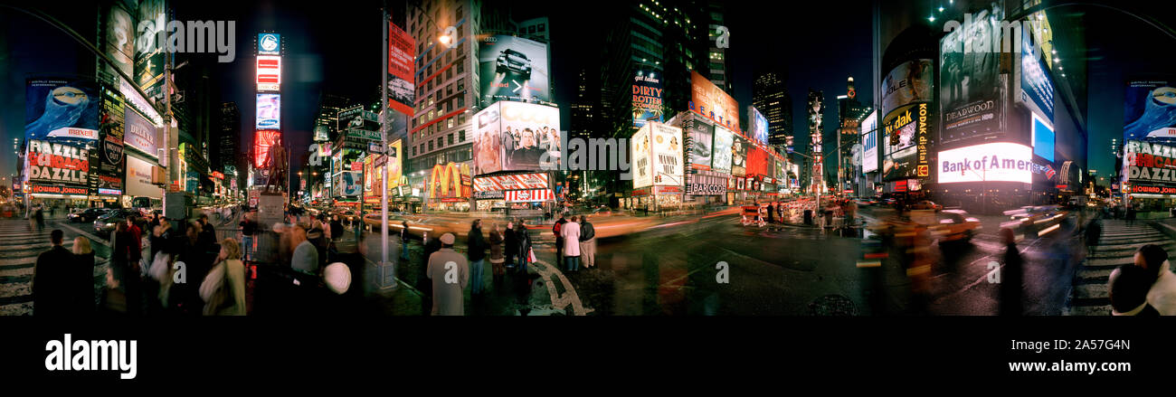 360 degree view of buildings lit up at night, Times Square, Manhattan ...