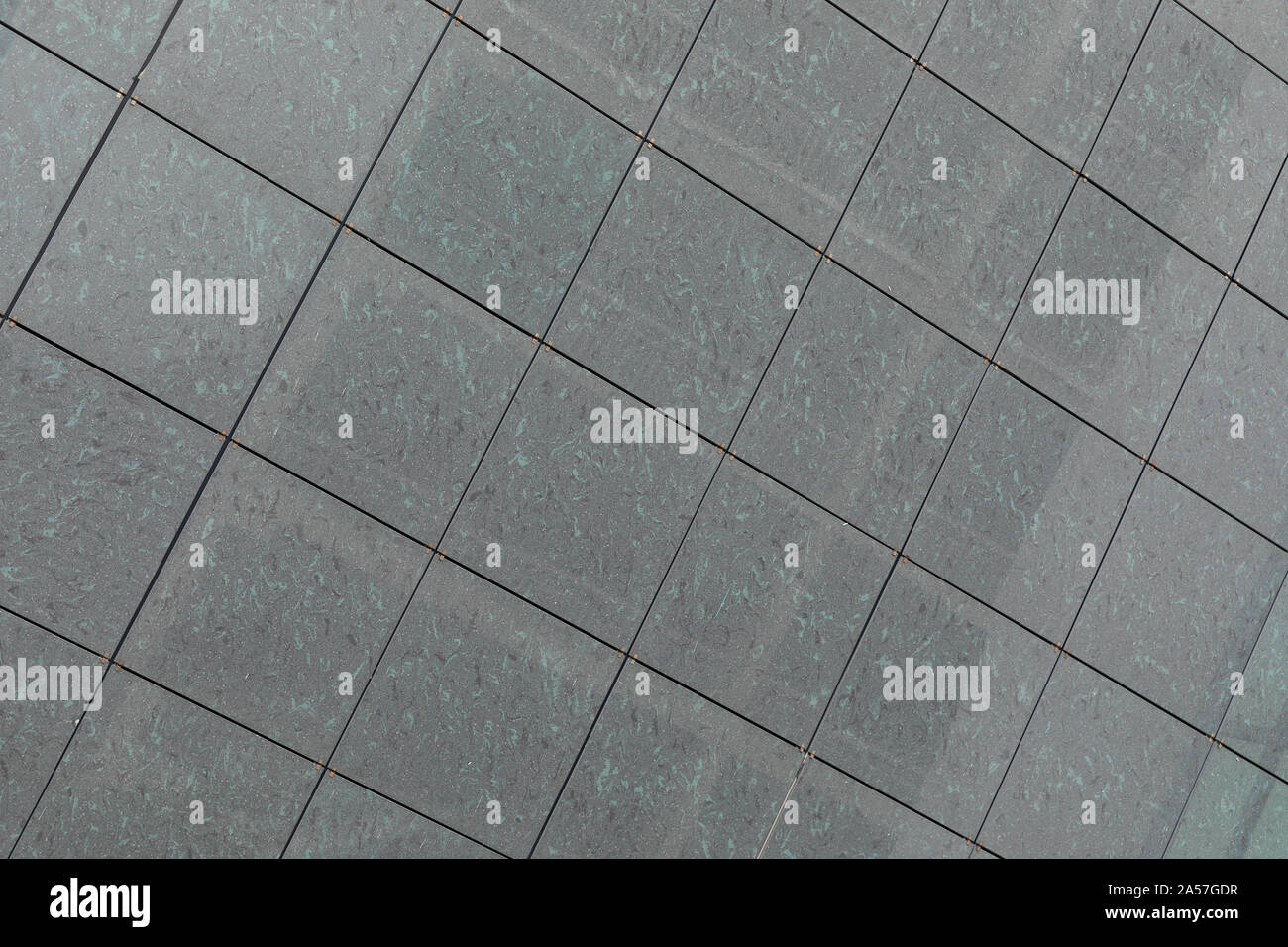 Gray stone square tiles on wall or floor, ground with diagonal view ...