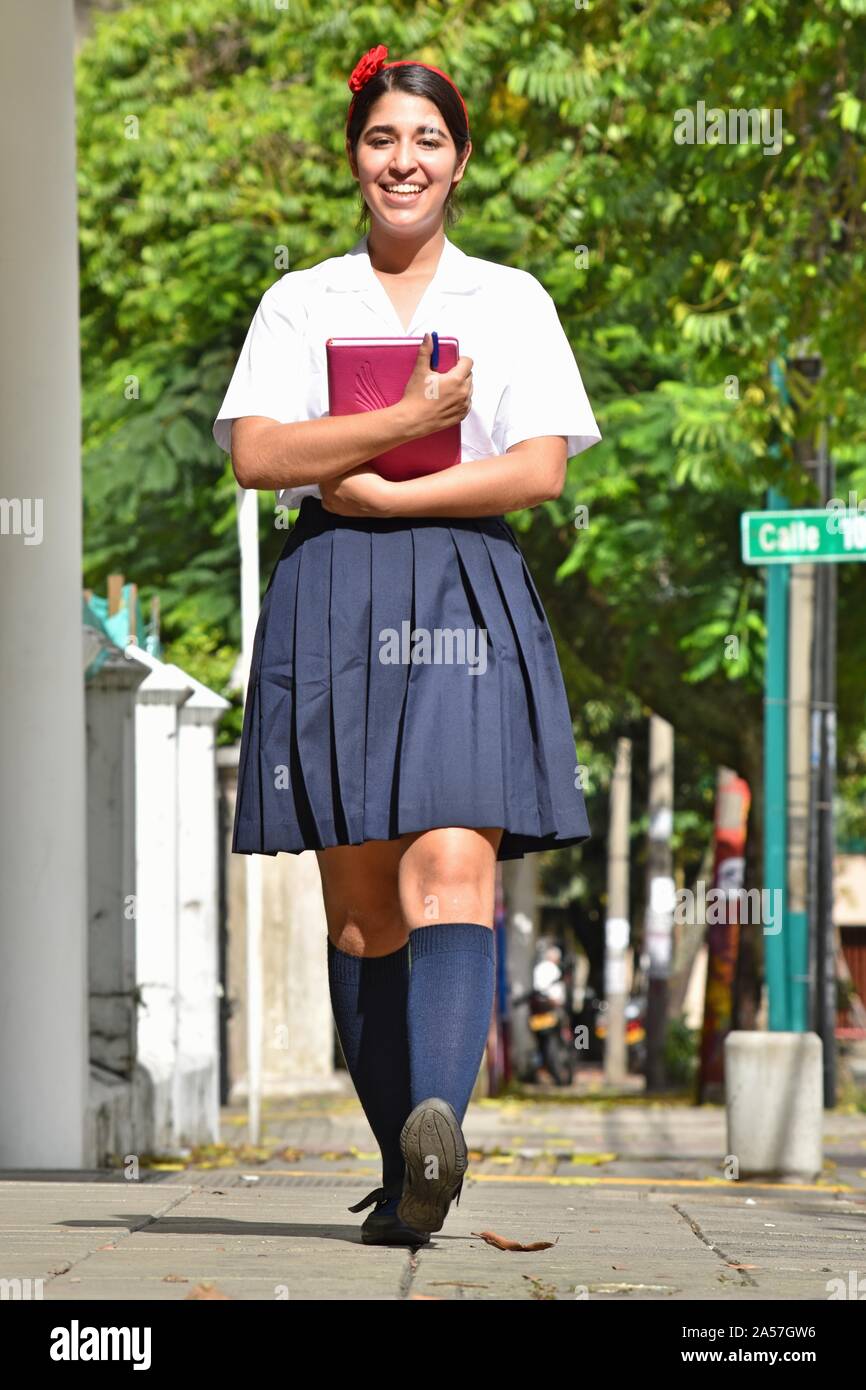 Female Student Walking To School Stock Photo - Alamy