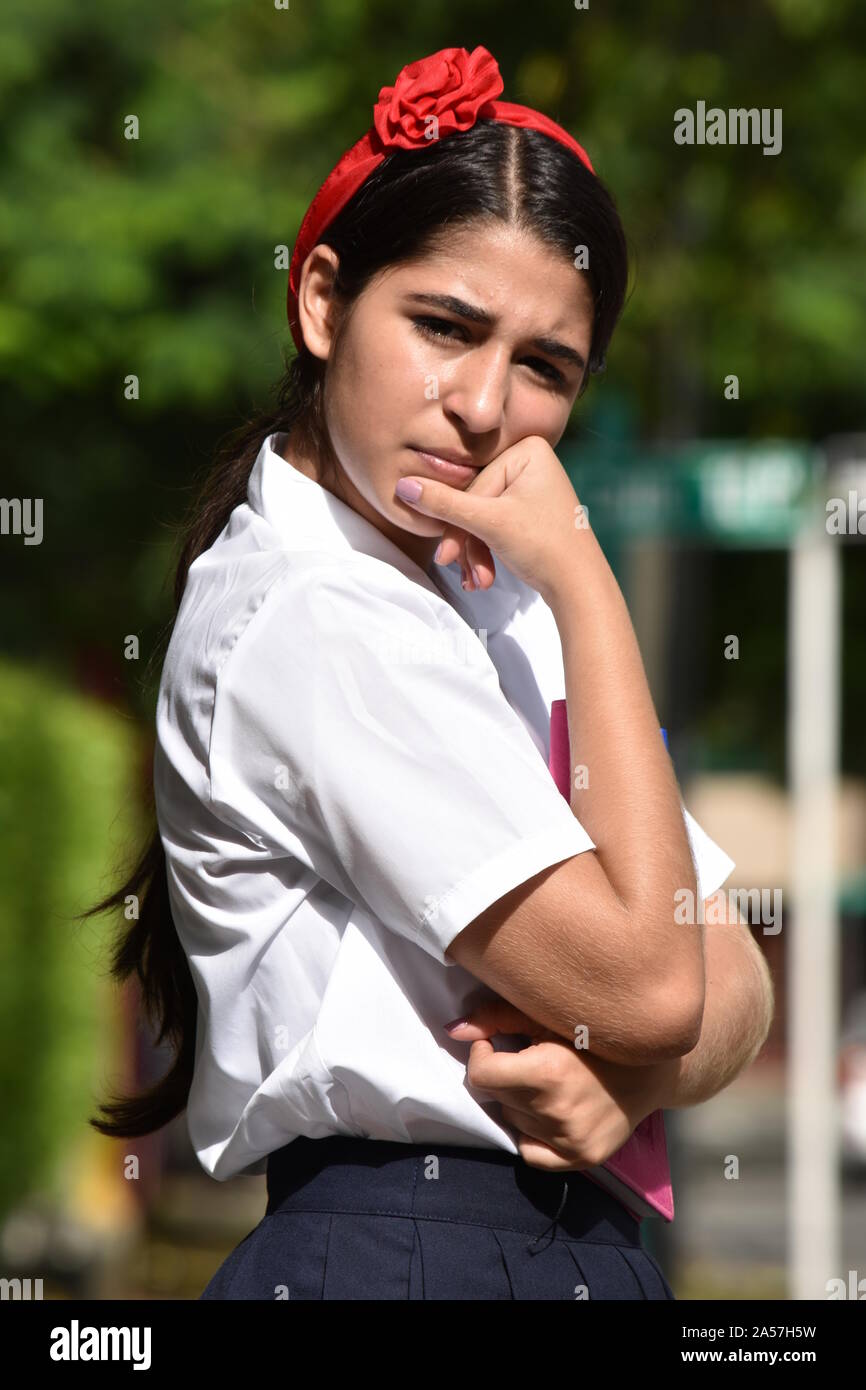 Thinking Cute Colombian Girl Student With Notebook Stock Photo - Alamy