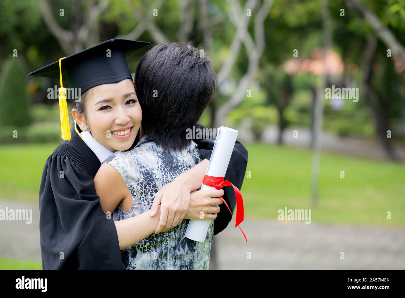 Happy smiling asian family at graduation ceremony hi-res stock ...