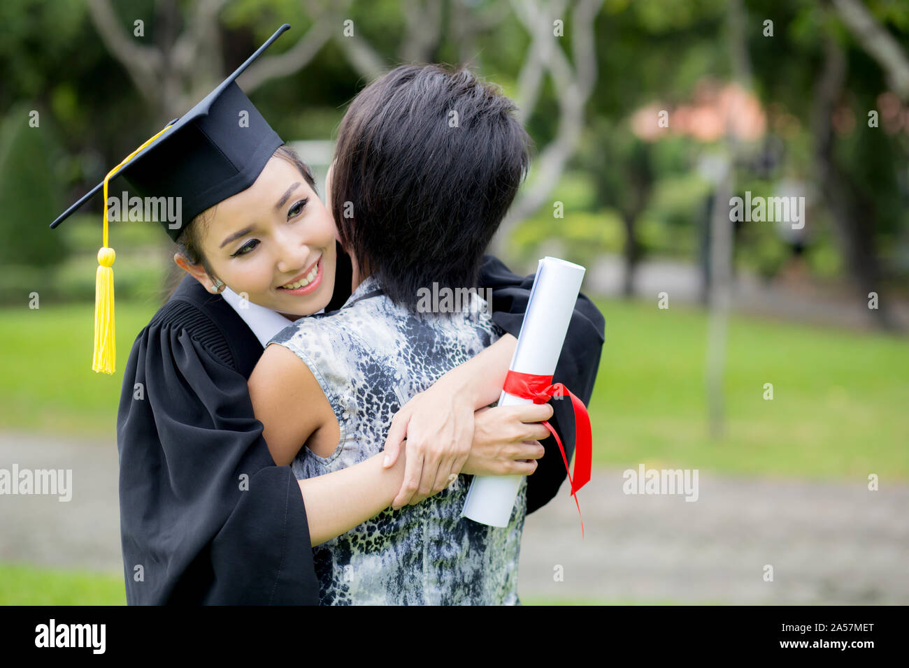 Happy smiling asian family at graduation ceremony hi-res stock ...