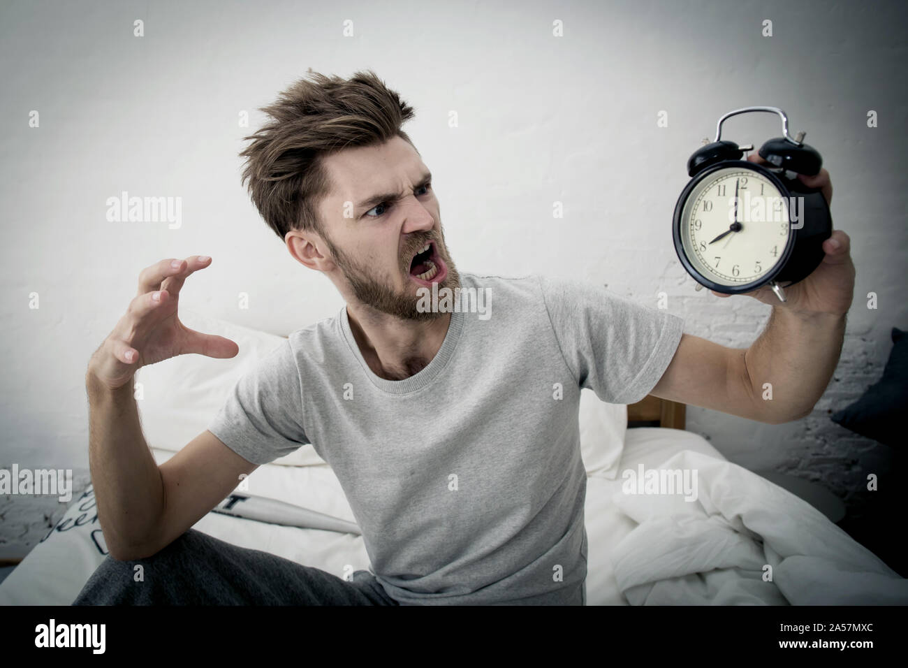 Angry man alarm clock hi-res stock photography and images - Alamy