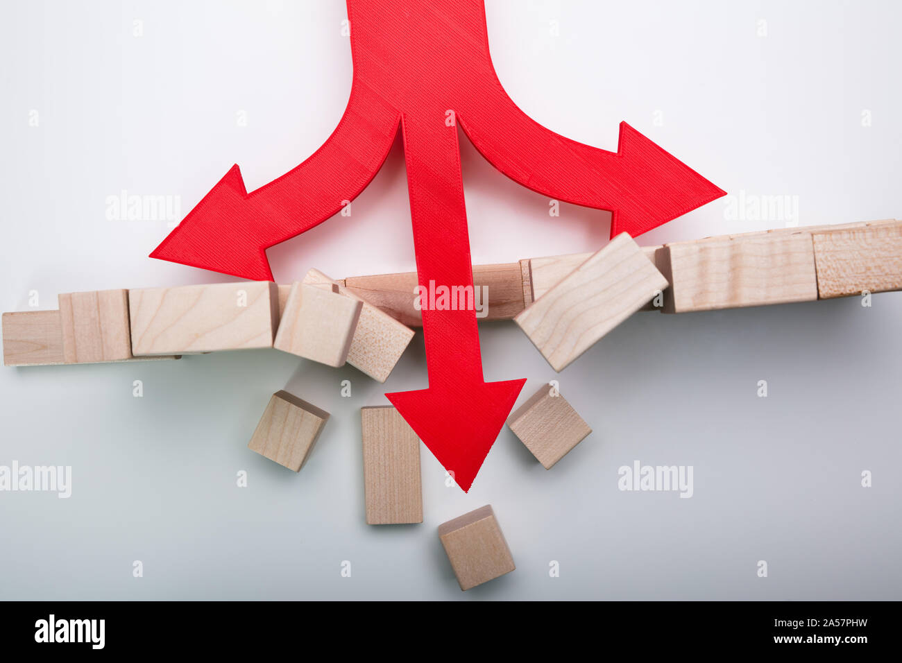 Arrow Breaking Through Wall Made Of Wooden Blocks On White Background ...
