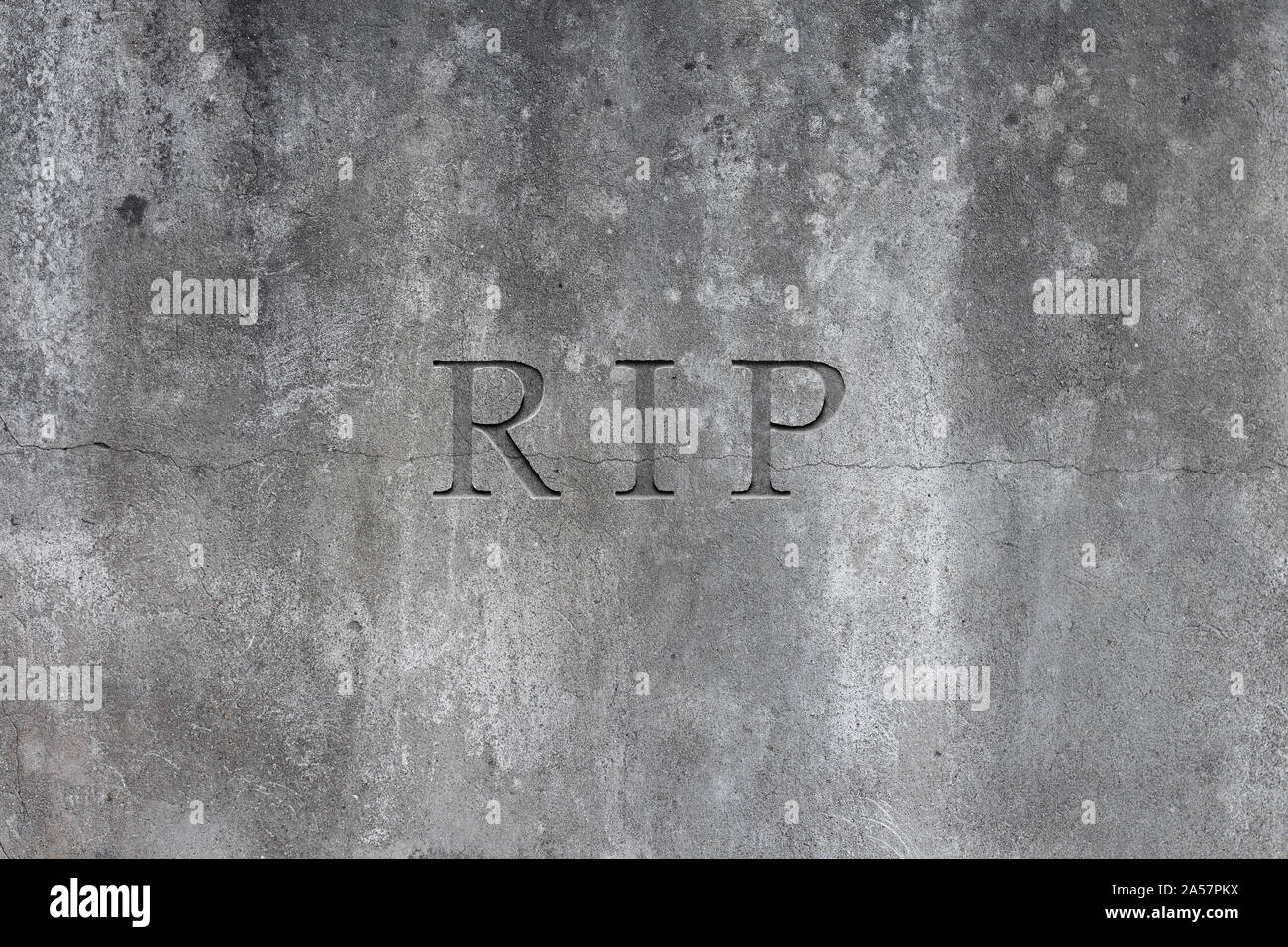 Old gray stone headstone with text R.I.P. carved in it Stock Photo - Alamy