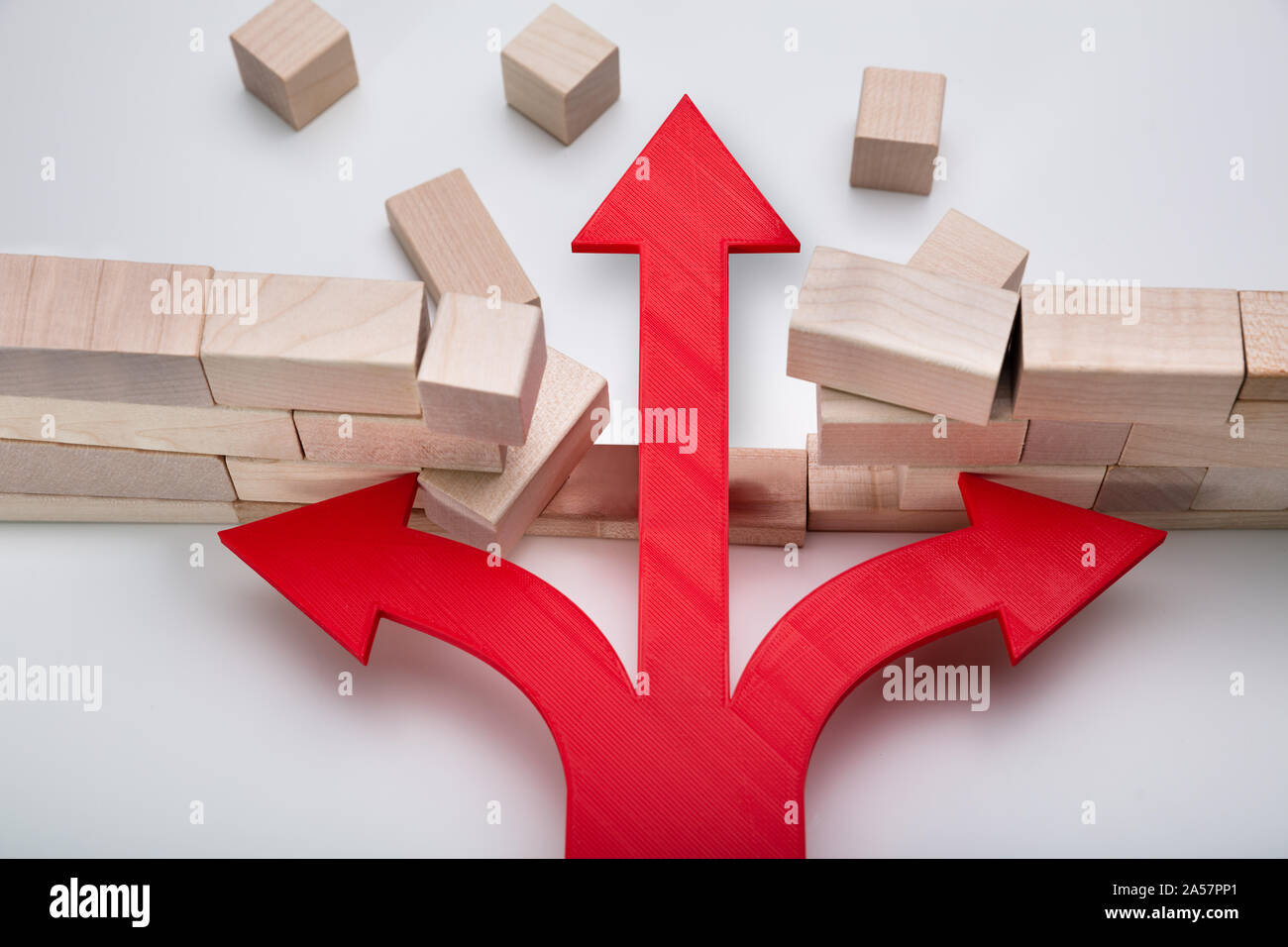 Arrow Breaking Through Wall Made Of Wooden Blocks On White Background ...