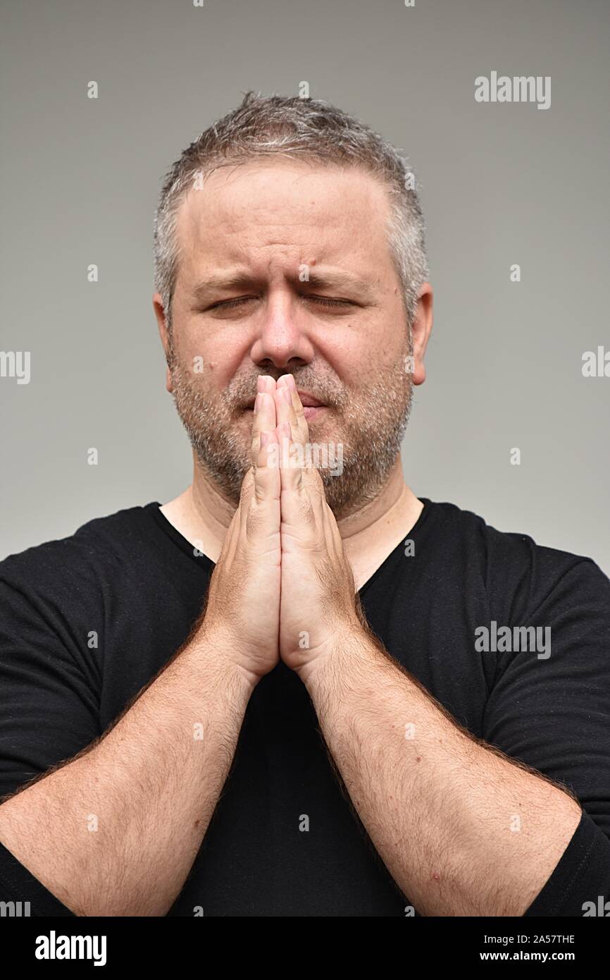 An Overweight Male Praying Stock Photo - Alamy