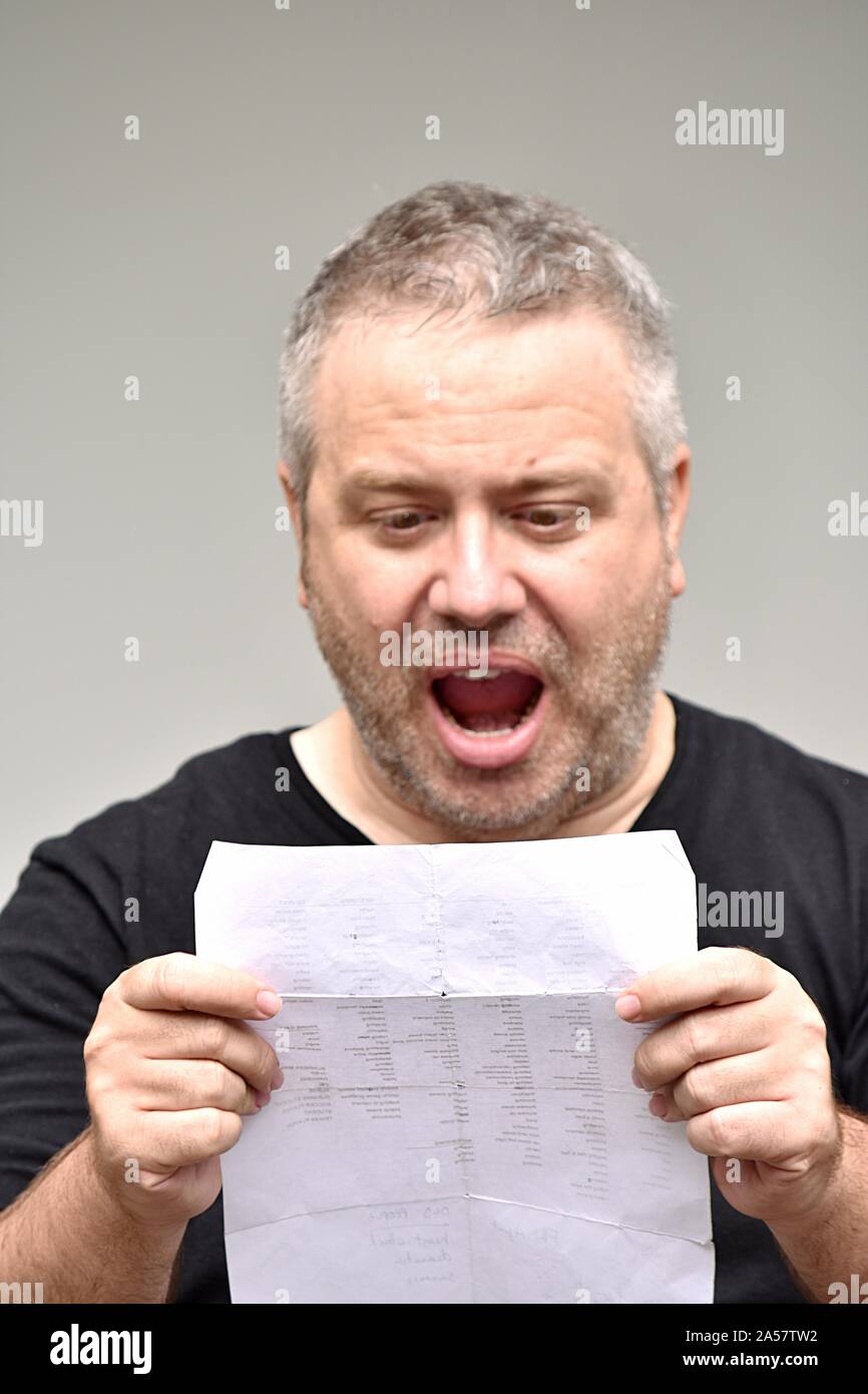 Surprised Overweight Man Reading Documents Stock Photo - Alamy