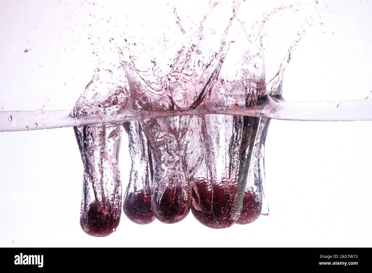 Cherry fruit red water splash white hi-res stock photography and images ...