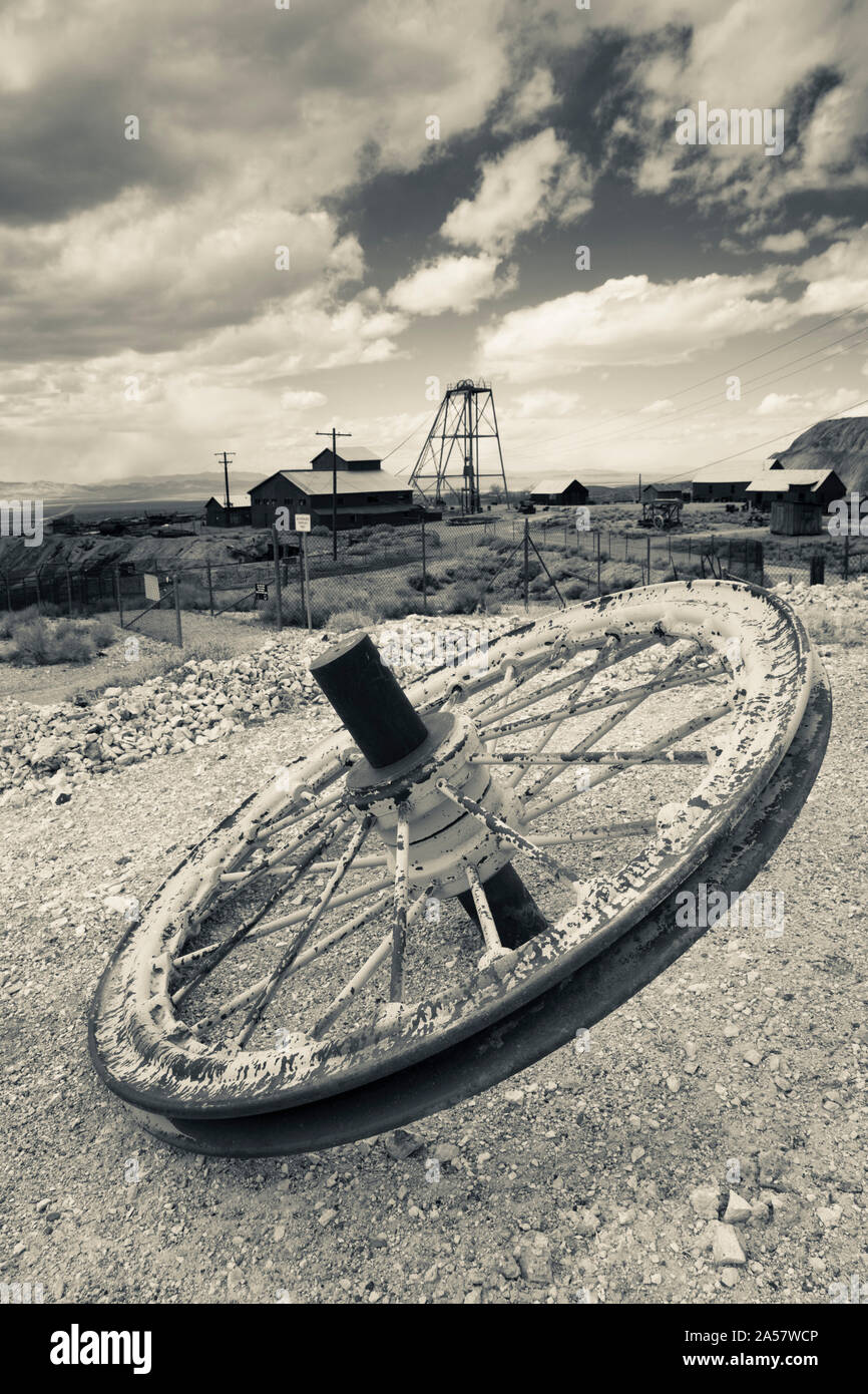 Tire with Desert Queen hoist house and mine in the background, Tonopah ...