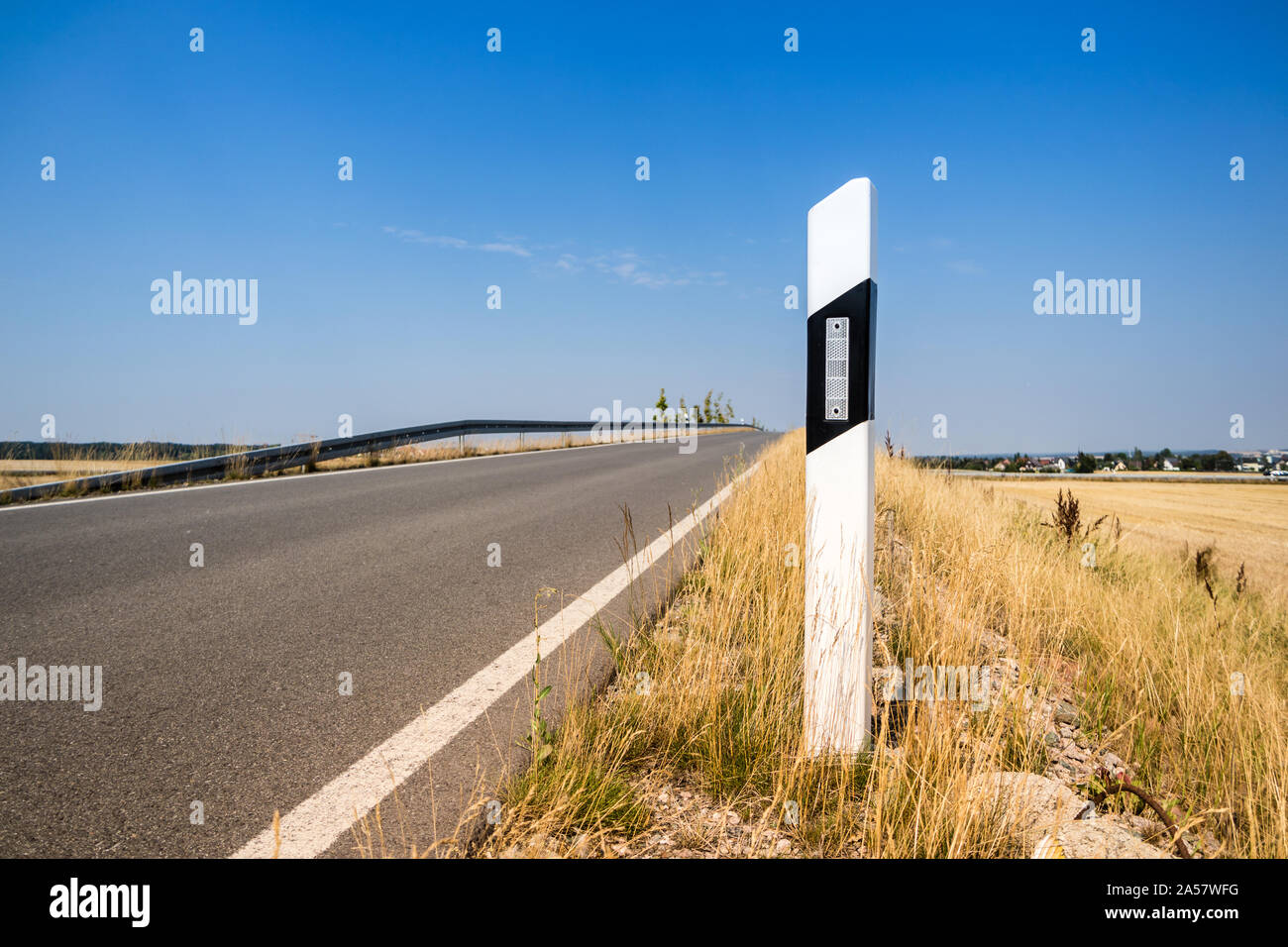 Guide posts on a country road in Germany Stock Photo - Alamy