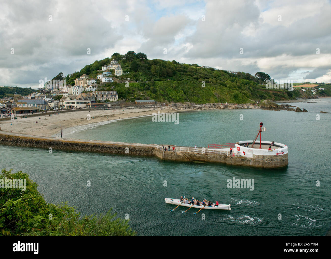 Rowing team and boat entering Looe harbour. South East Cornwall ...