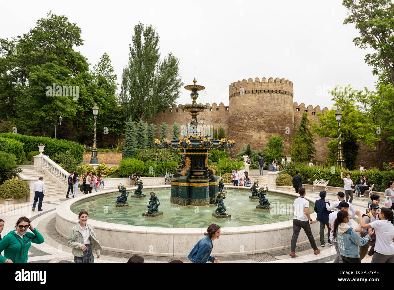 Philharmonic Fountain Park and the stone walls of the Old City of Baku ...