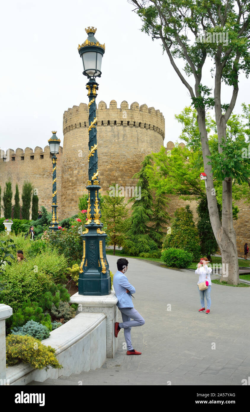 Philharmonic Fountain Park and the stone walls of the Old City of Baku ...