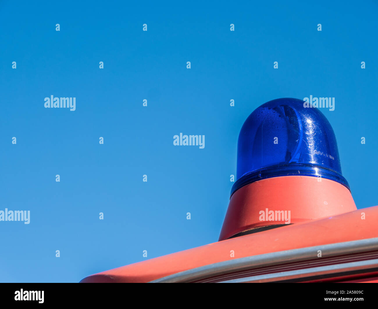 old blue light siren blue background Stock Photo - Alamy