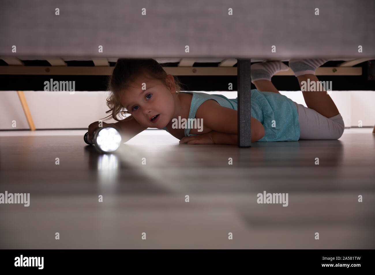 Kid looking for something at home hi-res stock photography and images ...