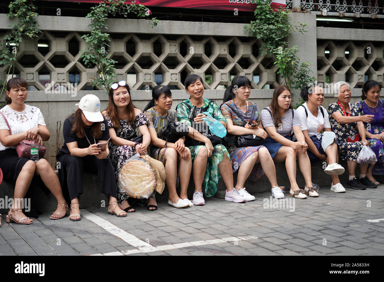 Sit side by side hi-res stock photography and images - Alamy