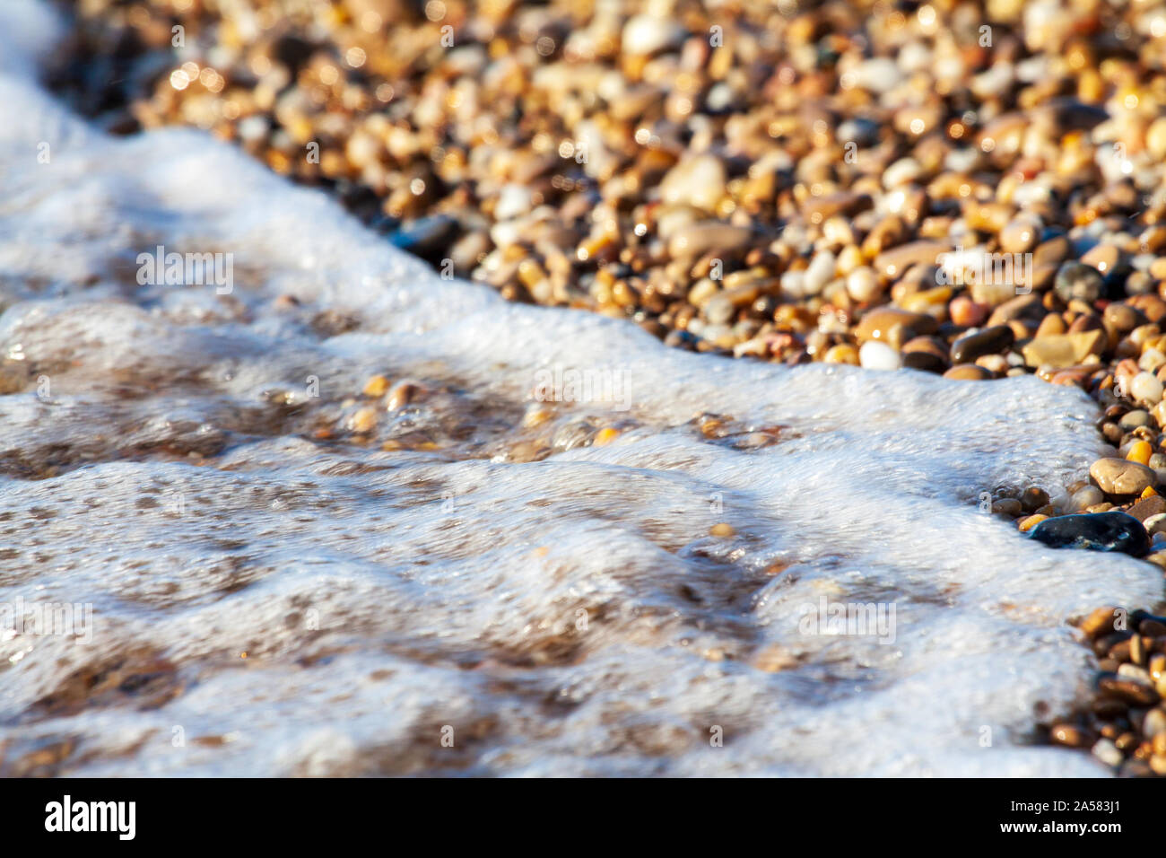 sea pebbles colored granite on the beach background stones. The shore ...