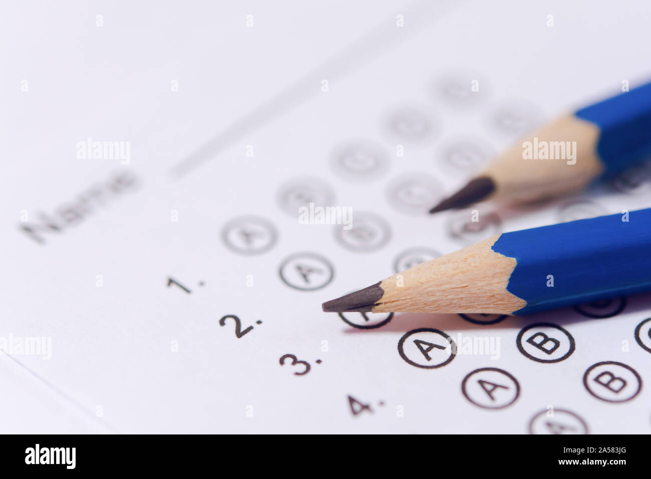 Pencil on answer sheets or Standardized test form with answers bubbled ...