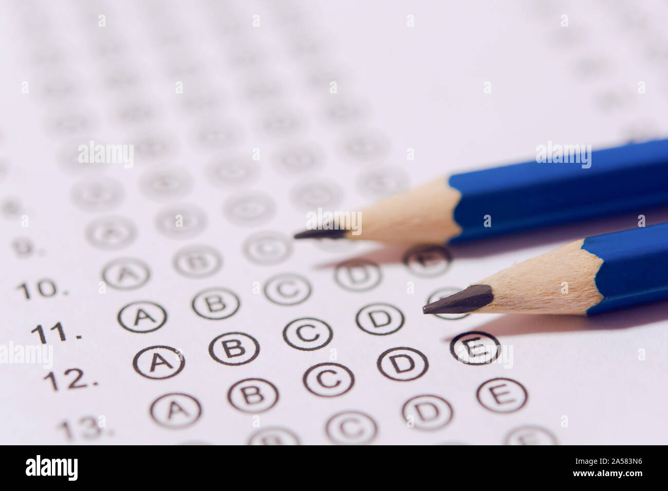 Pencil on answer sheets or Standardized test form with answers bubbled ...