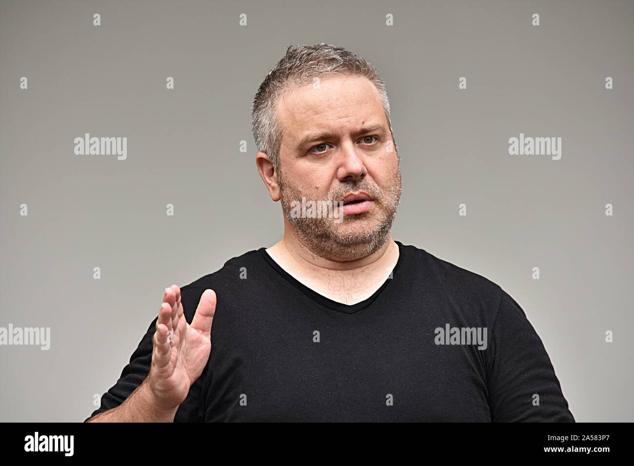 Adult Male Standing As A Statue Stock Photo - Alamy