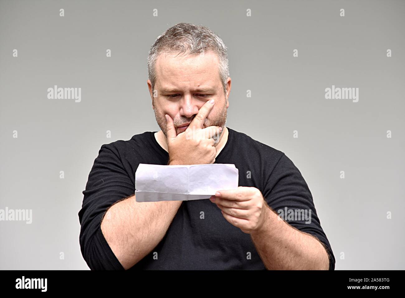 An Overweight Man Reading Documents Stock Photo - Alamy