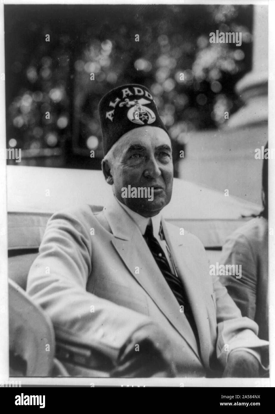 Warren G. Harding, half-length portrait, seated in vehicle, facing ...