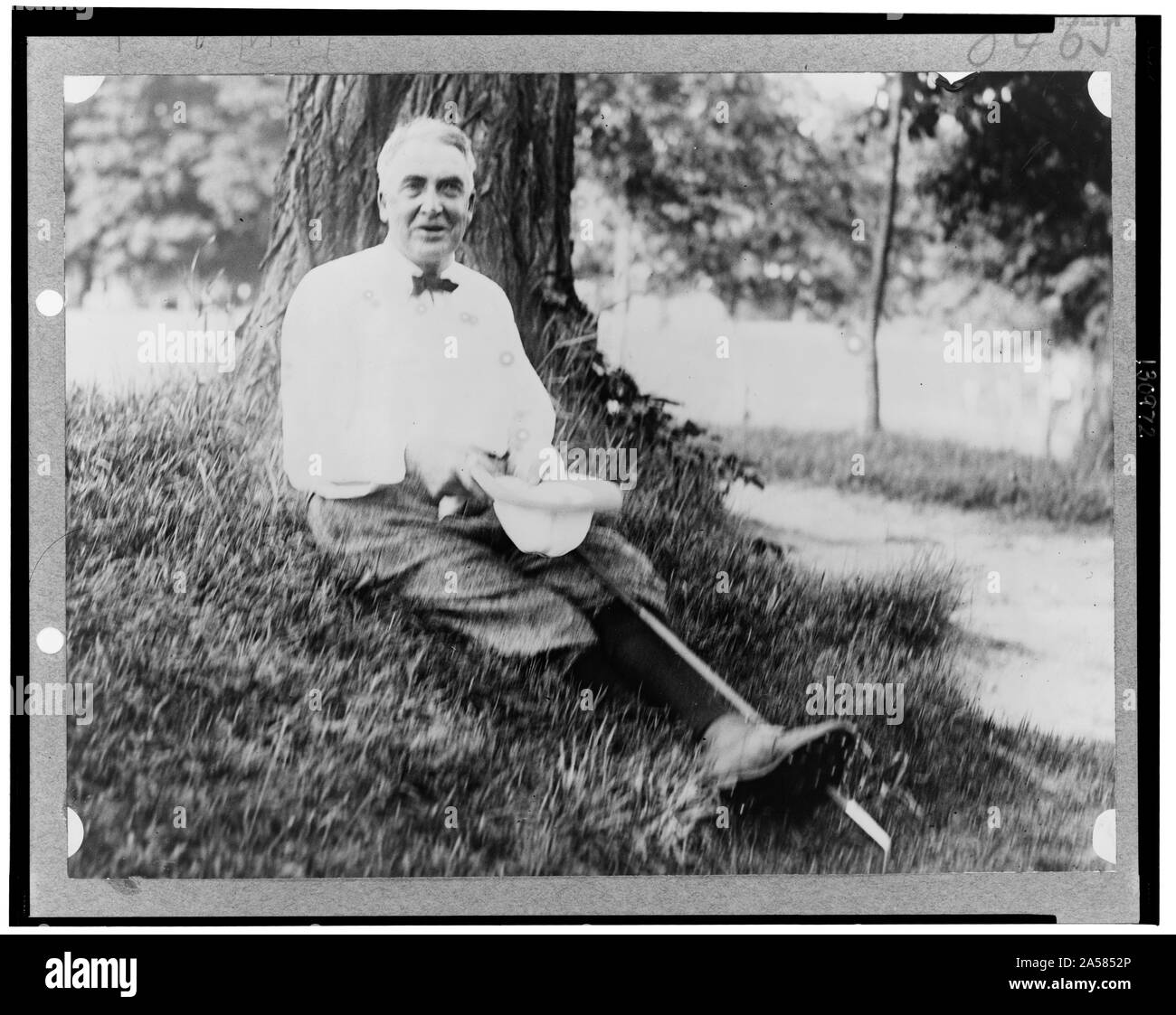 Seated beneath tree Cut Out Stock Images & Pictures - Alamy