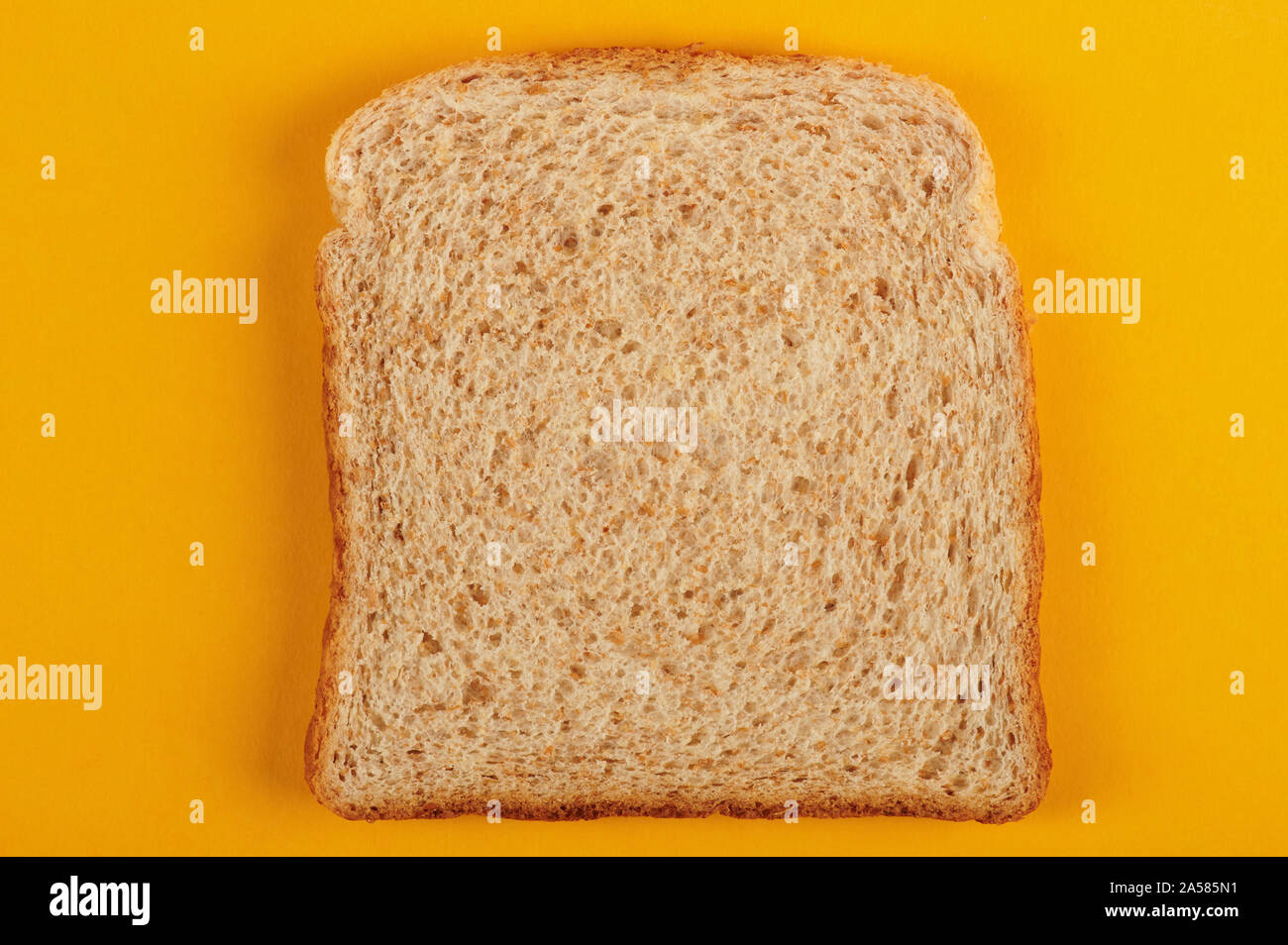 One square white bread slice top view on yellow background Stock Photo ...