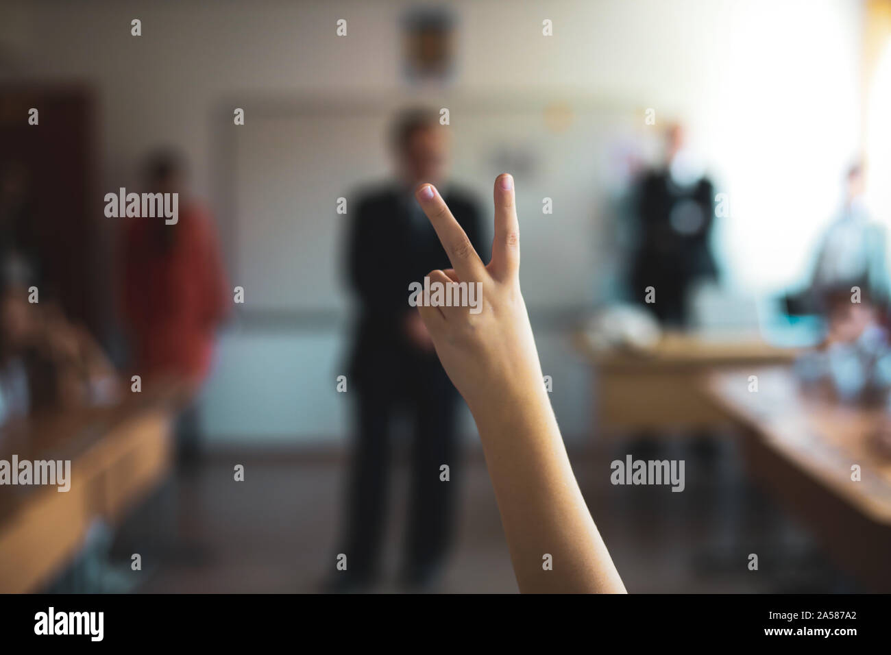 Kids put hands up classroom hi-res stock photography and images - Alamy