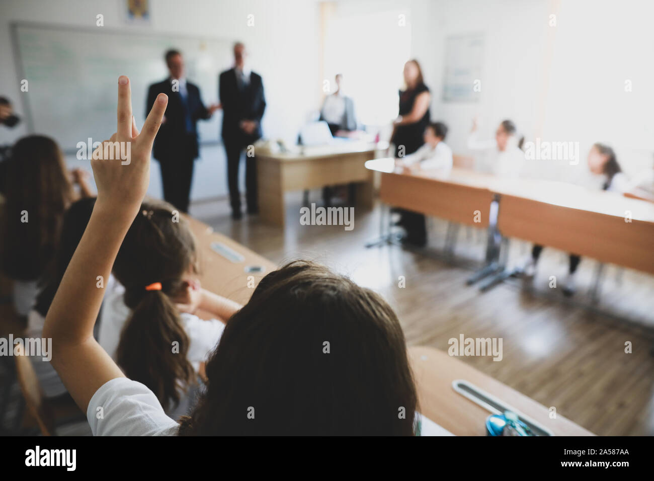 Children hands raised classroom hi-res stock photography and images - Alamy