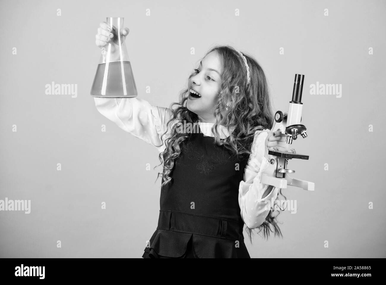 science research in lab. Small girl with microscope. child study bilogy ...