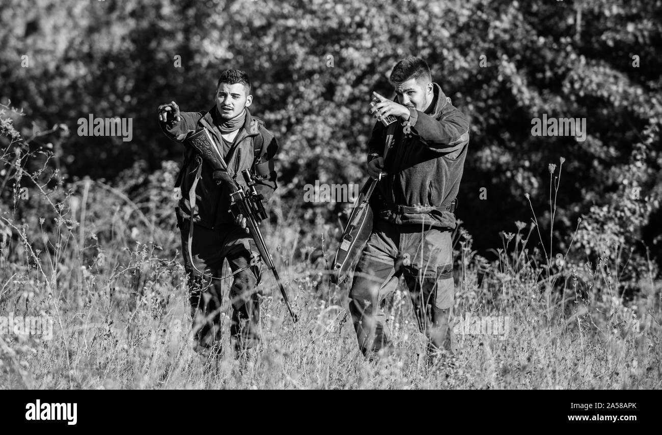 Hunters gamekeepers looking for animal or bird. Hunting with friends ...