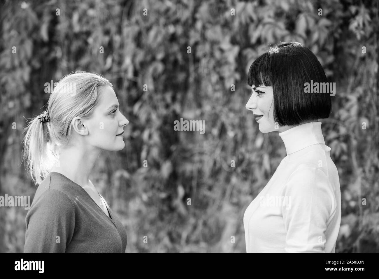 Eye contact. Women looking at each other with attention. Rivalry and ...