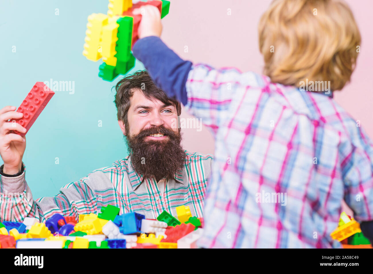 Child care and upbringing. Father son game. Father son create ...